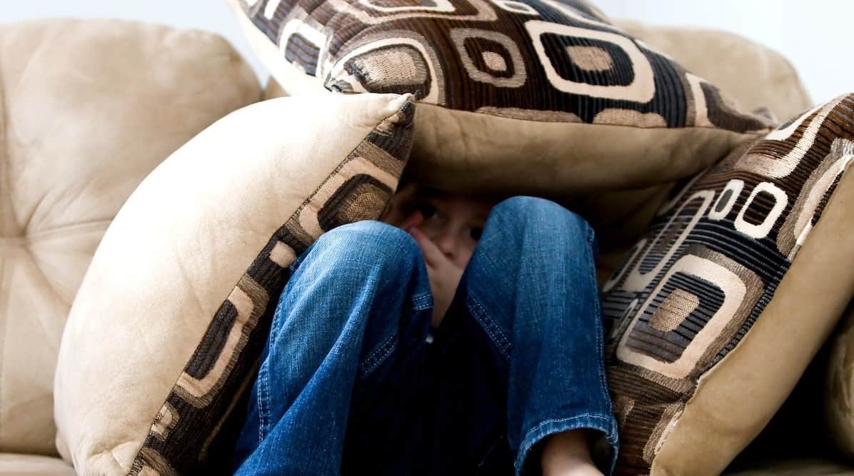 15 Spiritual Meanings of Dreams About Hiding From Someone